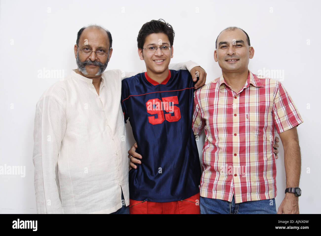 Portrait of men from three generation Stock Photo - Alamy