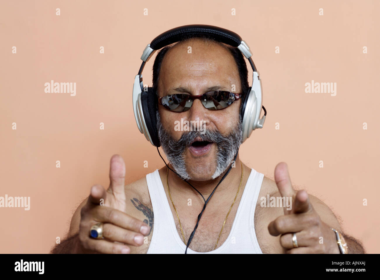 Indian old man listening music hi-res stock photography and images - Alamy