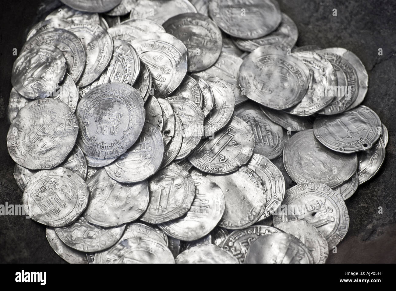 A treasure find containing Arabian silver coins Stock Photo - Alamy
