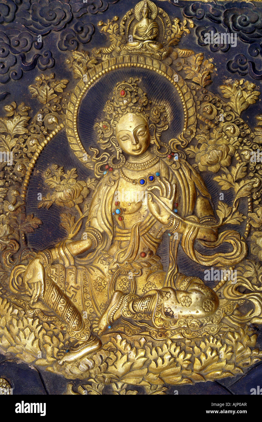 Golden statue of Green Tara peaceful tibetan buddhist female deity art ...