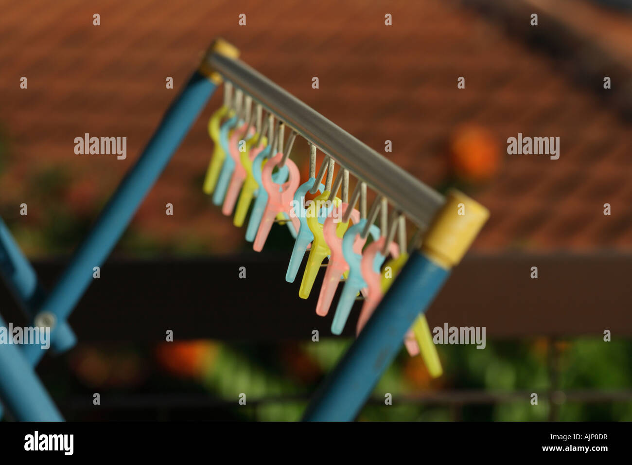 row of colorful clothes pegs Stock Photo - Alamy