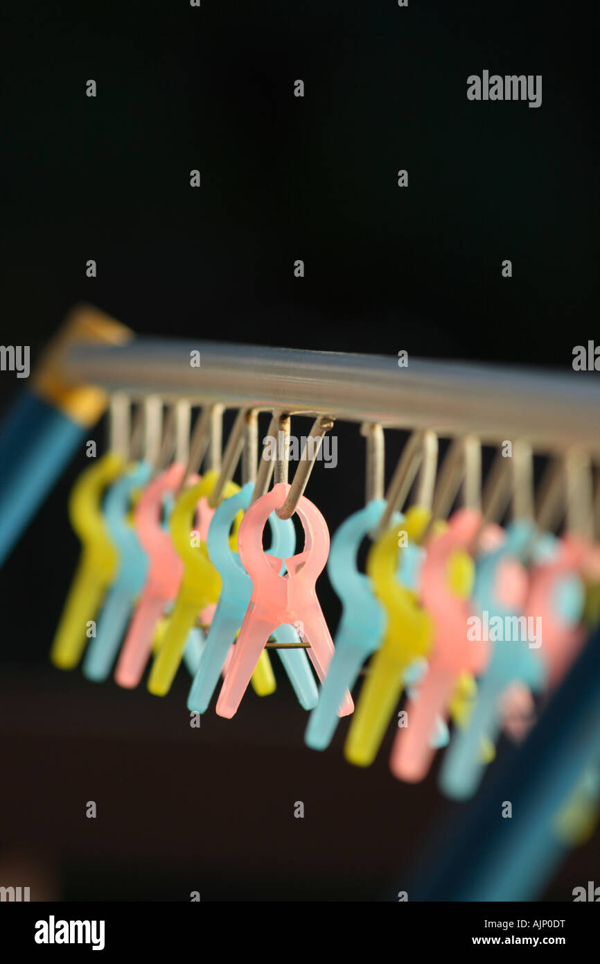 row of colorful clothes pegs Stock Photo - Alamy