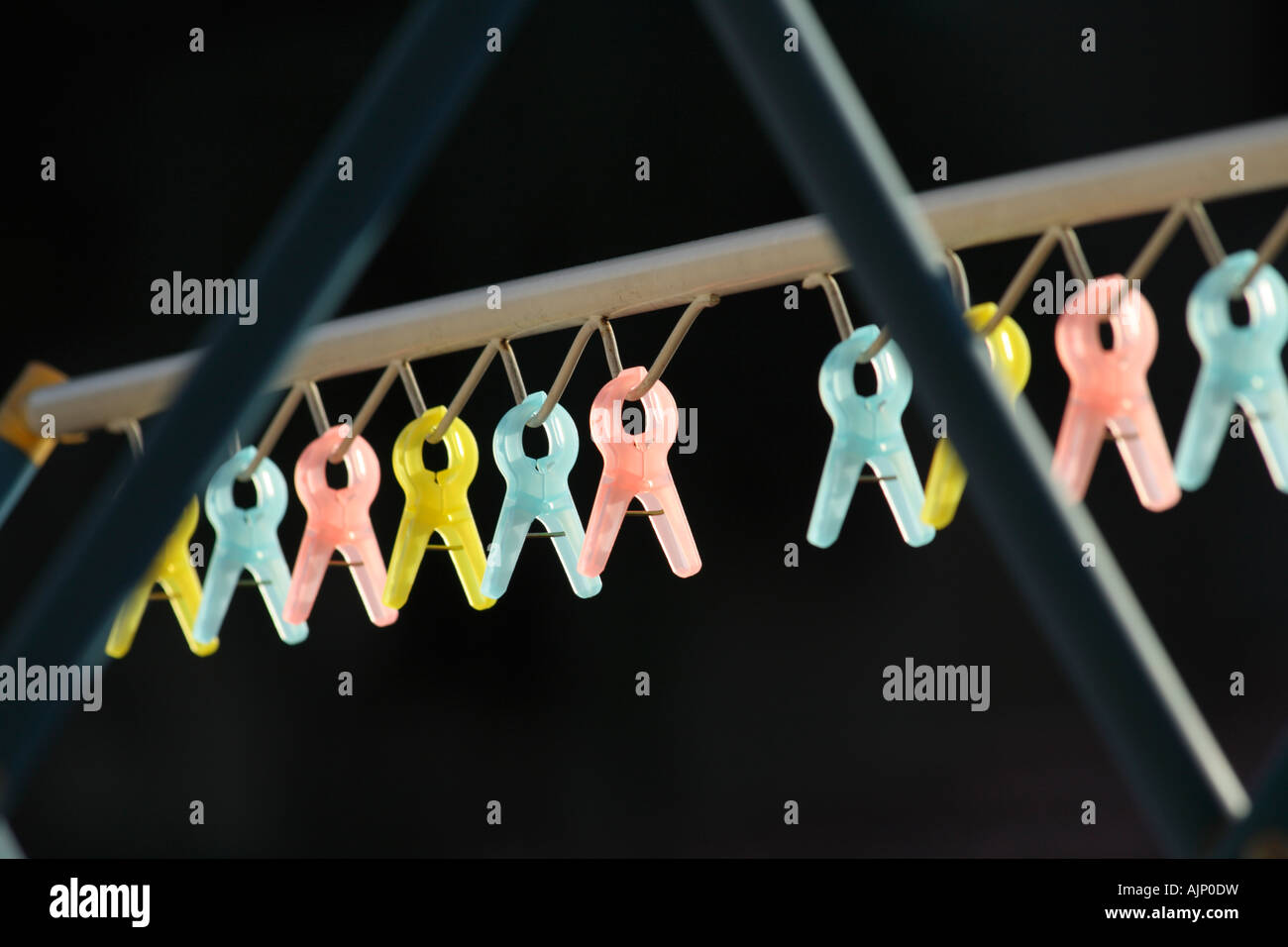 row of colorful clothes pegs Stock Photo - Alamy