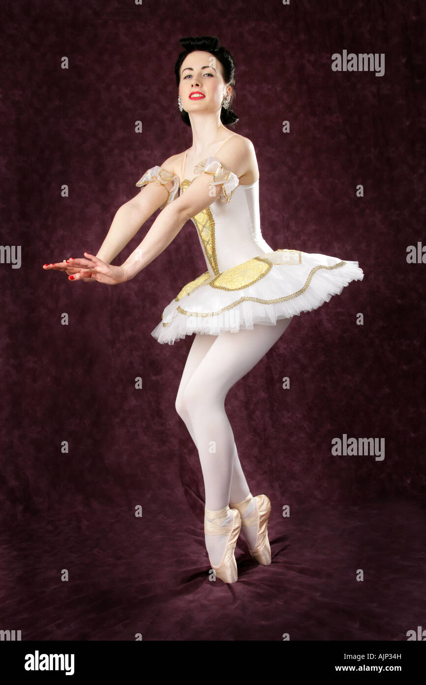 Ballerina in a White and Yellow Ballet Costume Stock Photo - Alamy