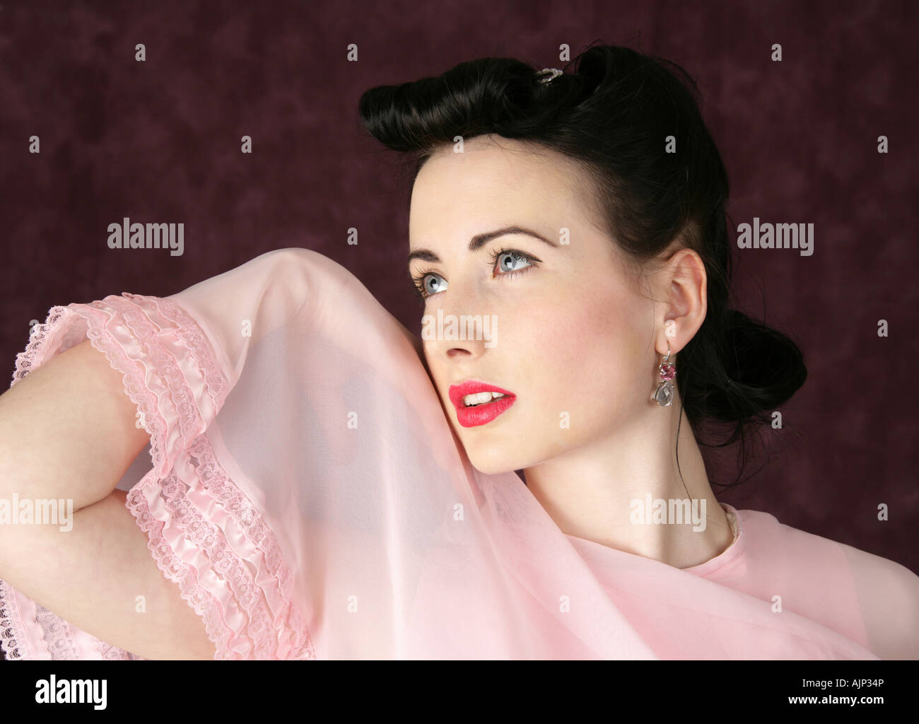 Pin Up Girl in a Pink Dress Stock Photo - Alamy