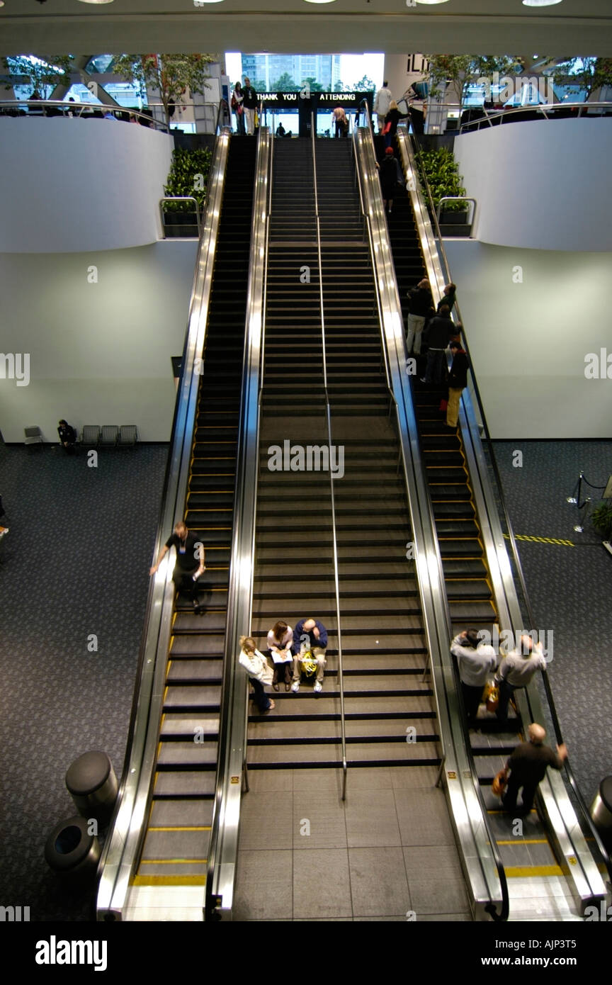 A long overall photograph of an escalator shot from above Stock Photo ...