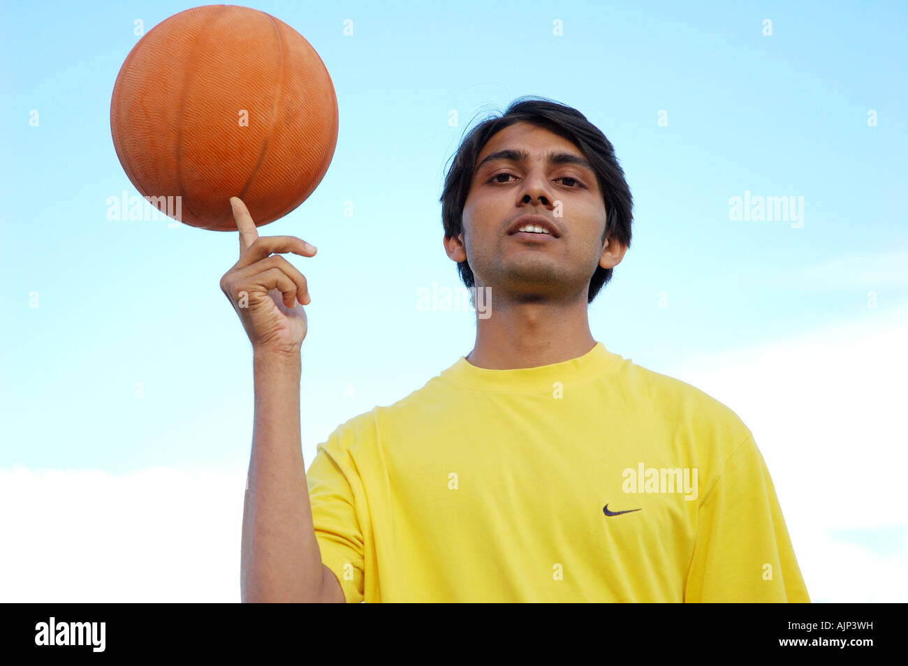 Young man holding basketball Stock Photo - Alamy Young man holding basketball Stock Photo - Alamy