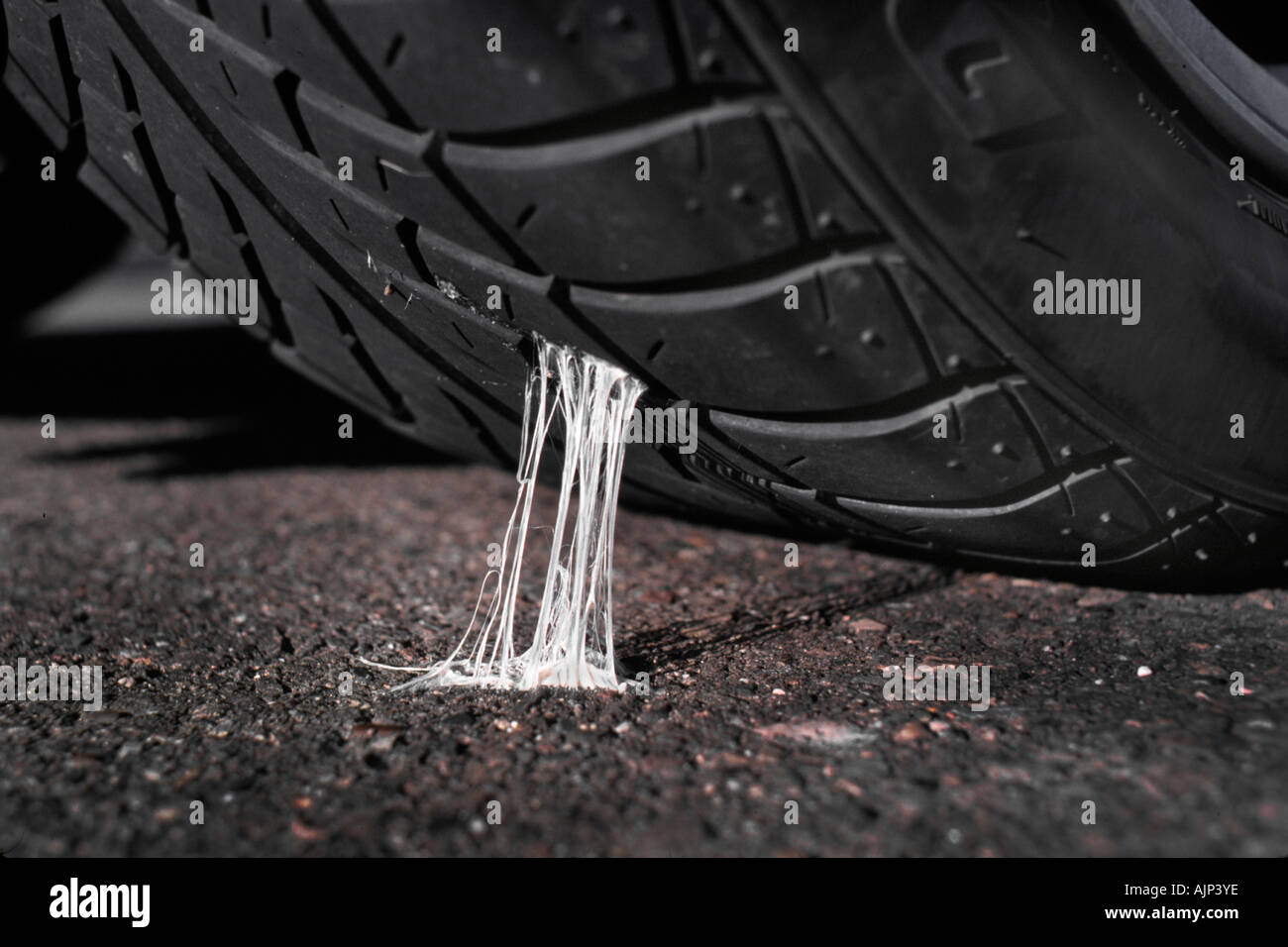Chewing gum stuck to an automobile tire in a parking lot Stock Photo ...