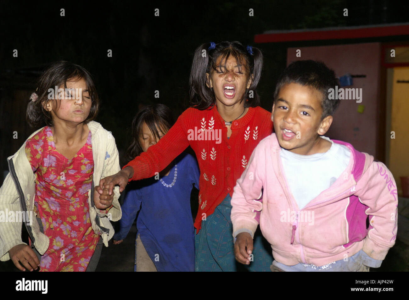 Three indian children running outdoors at night. India Stock Photo - Alamy