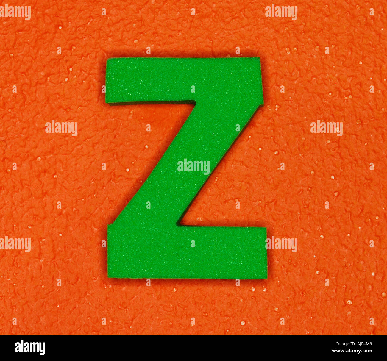 GREEN ALPHABET LETTER Z ON ORANGE BACKGROUND Stock Photo - Alamy