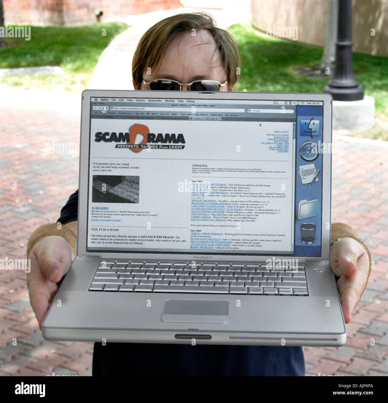 A man is hidden behind his laptop computer Stock Photo - Alamy