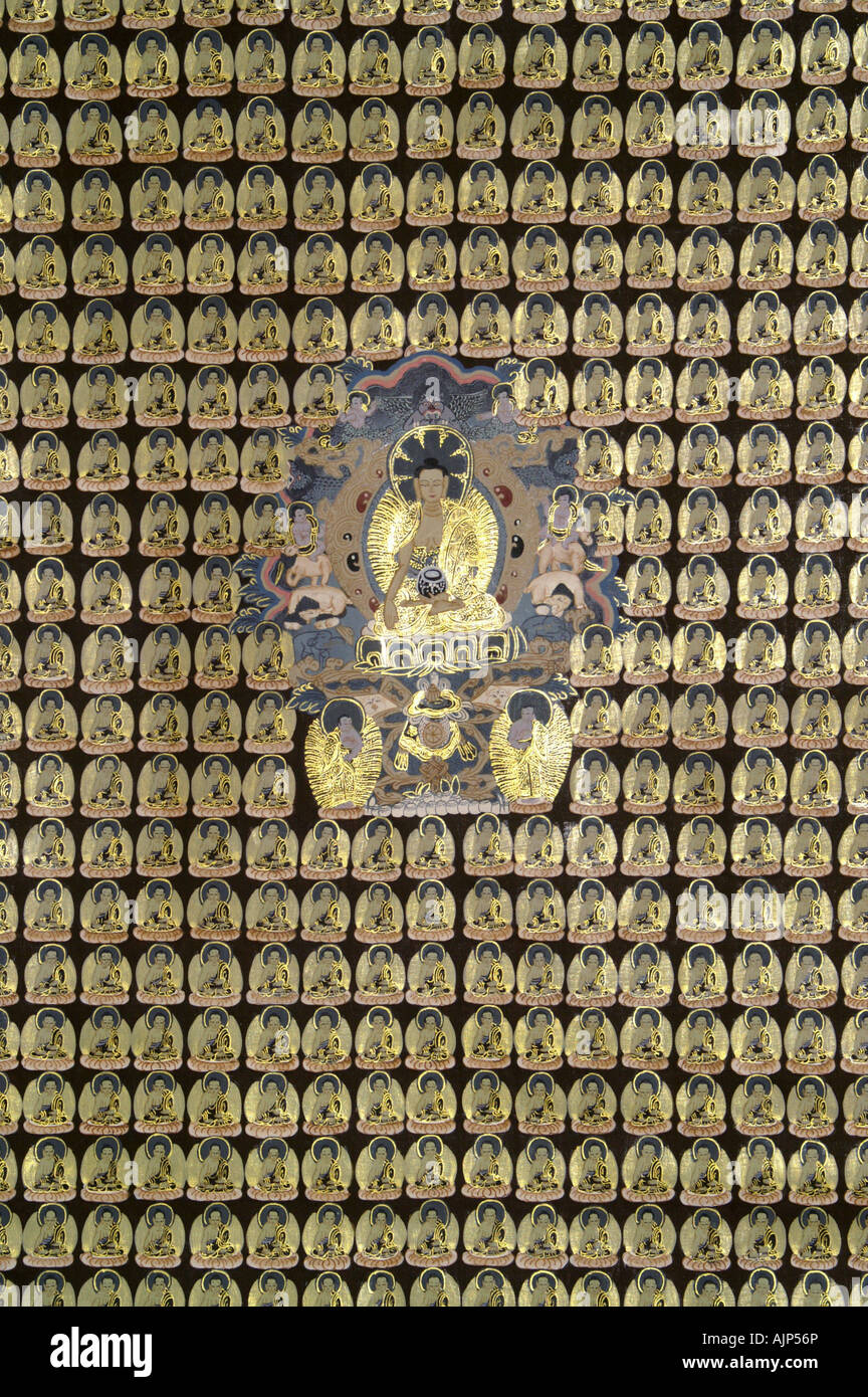 Thanka tibetan buddhist painting of many golden Buddhas Stock Photo - Alamy