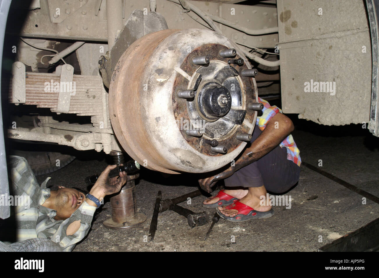 Bus driver repairing broken vehicle hi-res stock photography and images ...