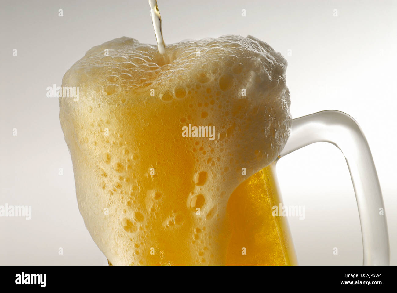 POURING BEER GLASS MUG OF BEER Stock Photo - Alamy