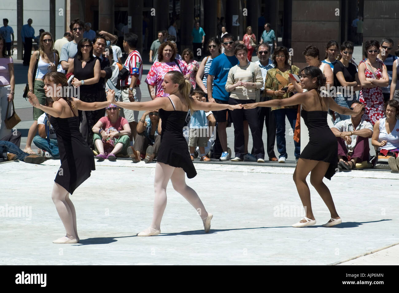 Three female dancers in a street contemporary dance festival. Plaza del ...