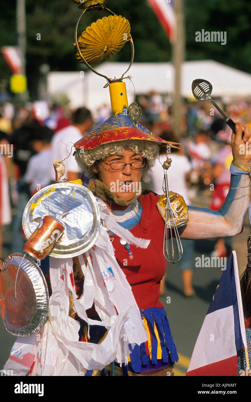 Woman dressed in costume at the "Tintamarre" celebration in Caraquet ...