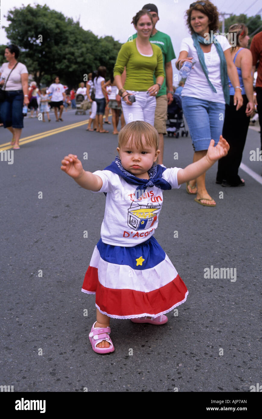A young girl dressed in the colours of the acadian flag at the ...