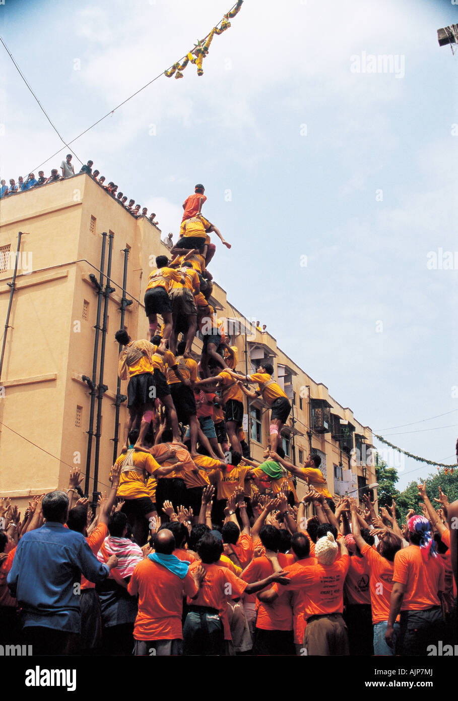 Men forming human ladder at Janmashtami, mumbai Stock Photo - Alamy