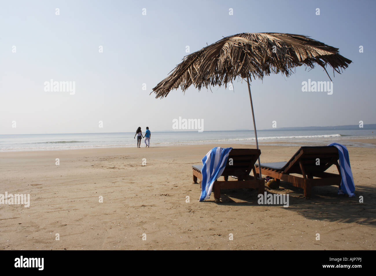 Couple spending time together at a beach Stock Photo - Alamy