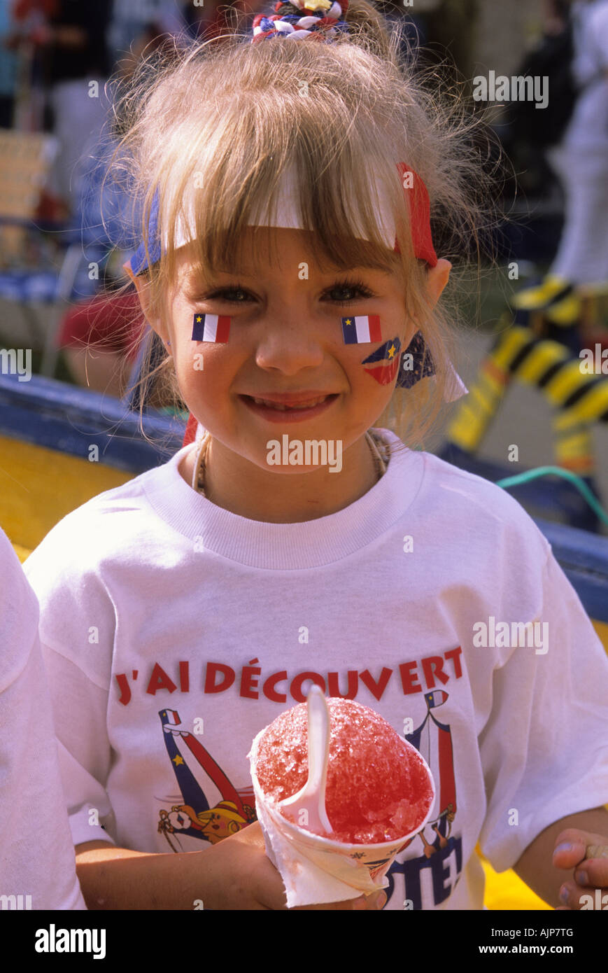 Young girl with acadian flags painted on her face at the acadian ...
