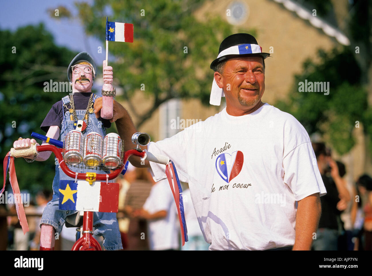 Man with "dummy" parade float at the acadian 'Tintamarre" celebration ...
