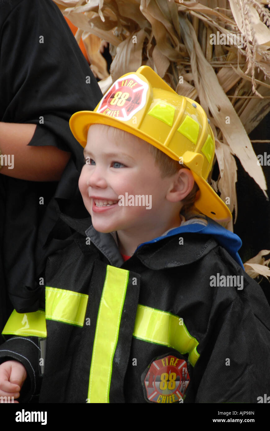 Boy dressed as firefighter for Halloween Stock Photo - Alamy