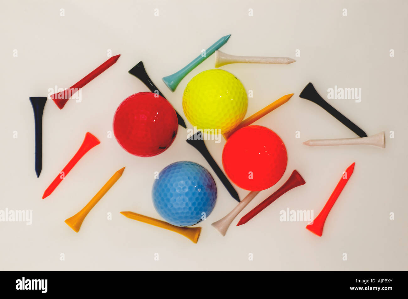 coloured golf balls tee Stock Photo - Alamy