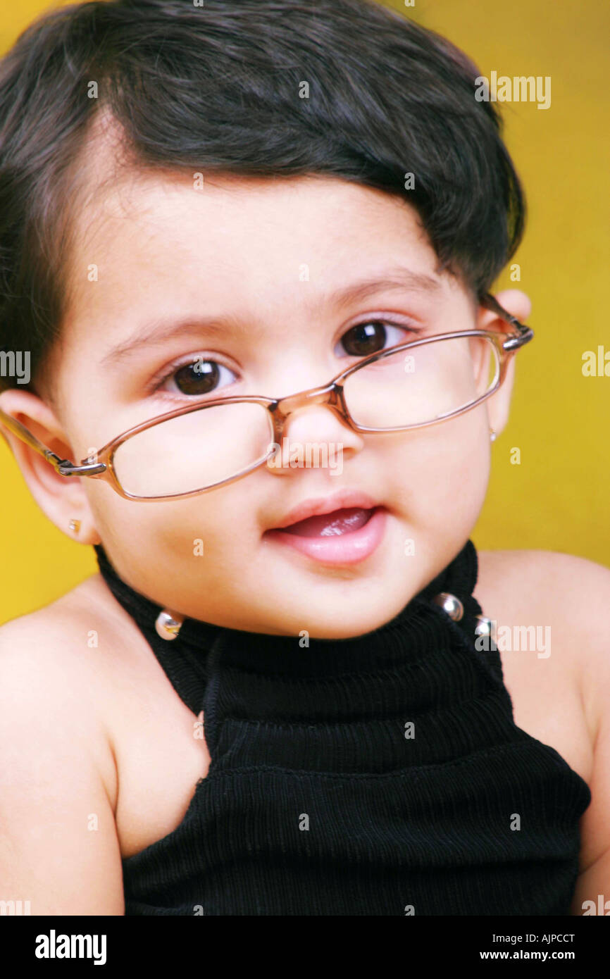 Portrait of a toddler with spects Stock Photo - Alamy