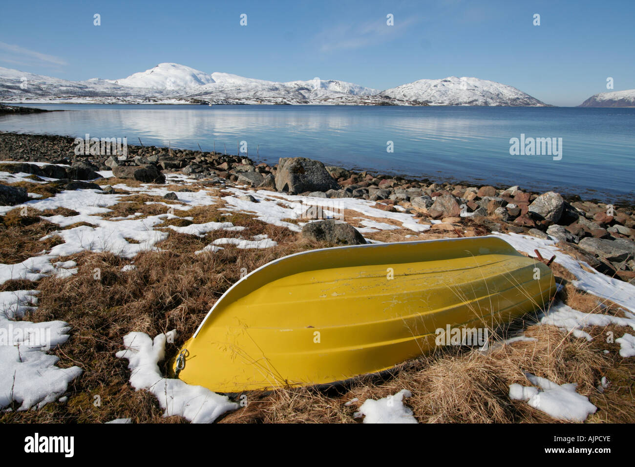 spring troms countryside hull of rowing boat snow thawing norway ...