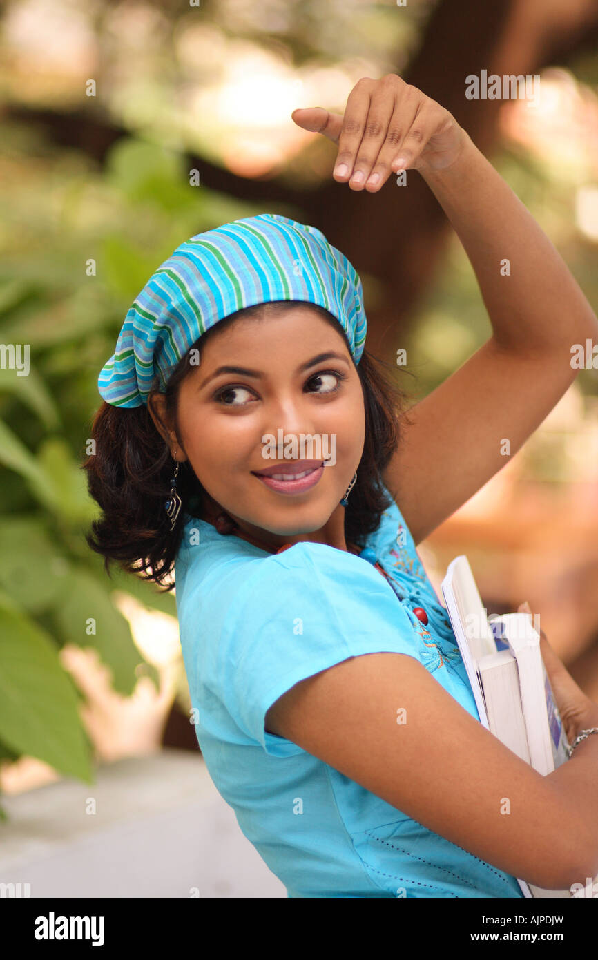 Portrait of a teenage girl calling someone Stock Photo - Alamy