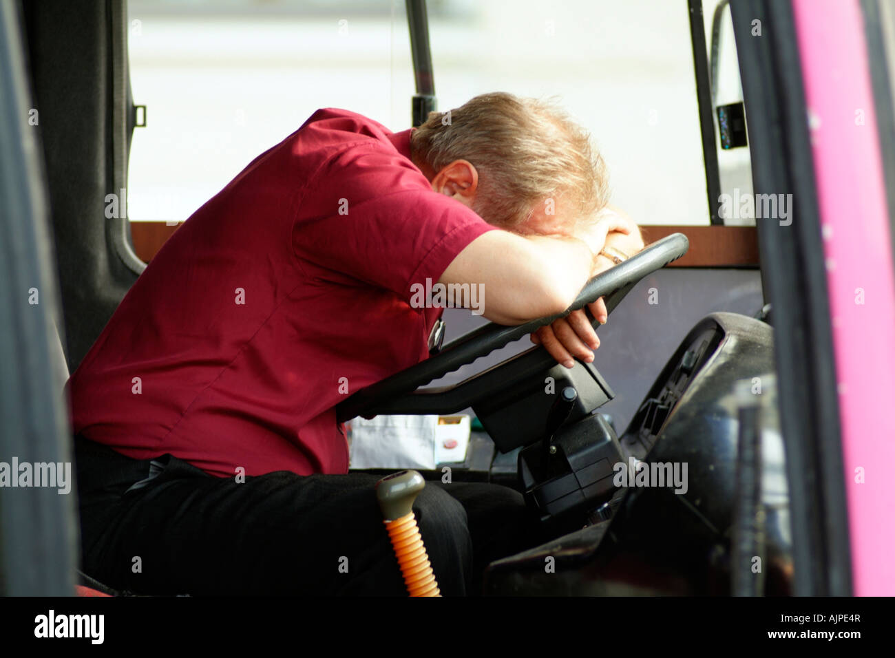 Exhausted Coach Driver Asleep at the Wheel Tourbus driver taking a nap ...