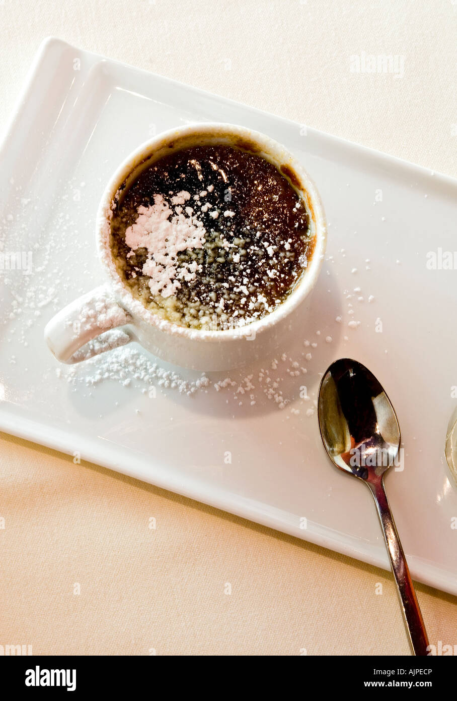 A cup of coffee on tray with a spoon Stock Photo - Alamy