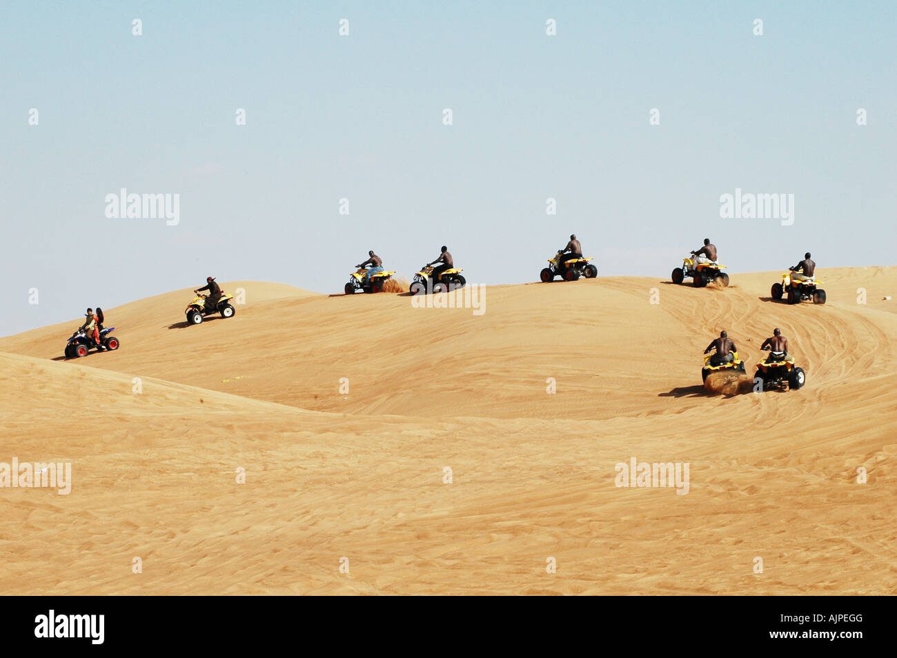 Quad bike racing in desert Stock Photo - Alamy