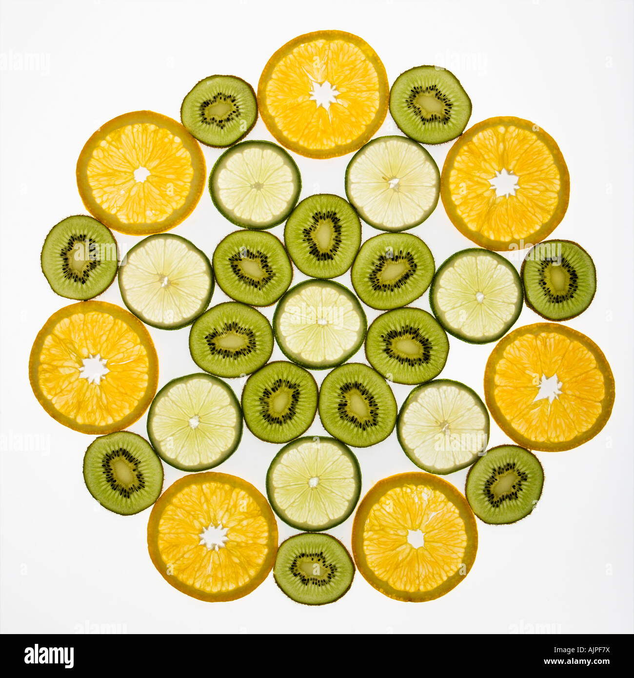 Assorted fruit slices arranged in pattern on white background Stock ...