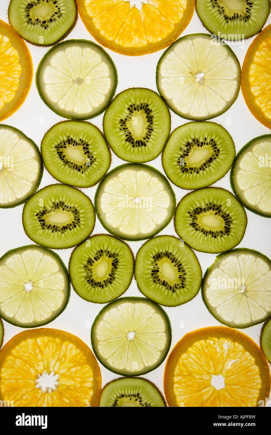 Assorted fruit slices arranged in pattern on white background Stock ...