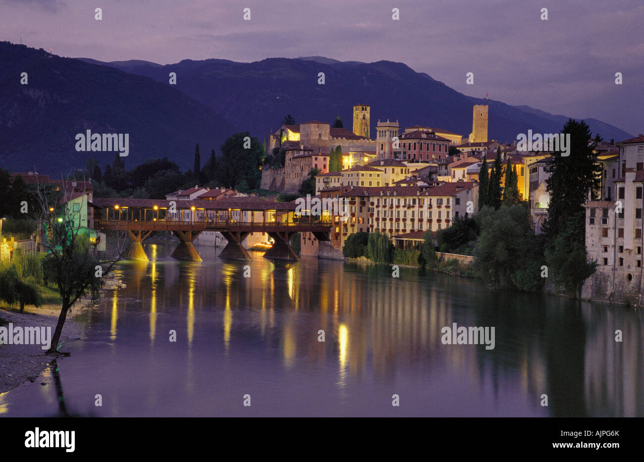Bassano del Grappa Italy The town illuminated at dusk showing the Ponte ...