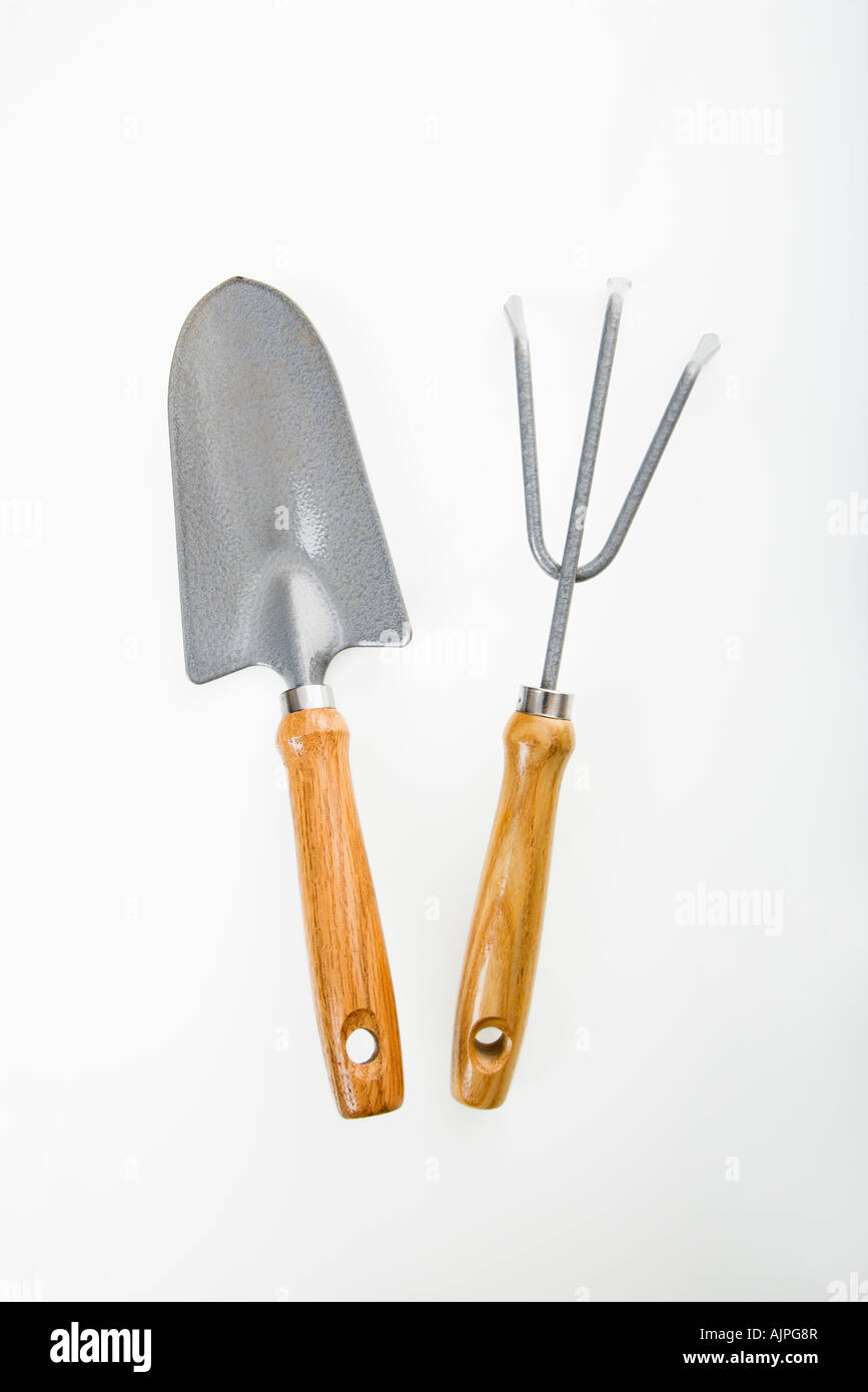 Hand held spade and gardening fork Stock Photo - Alamy