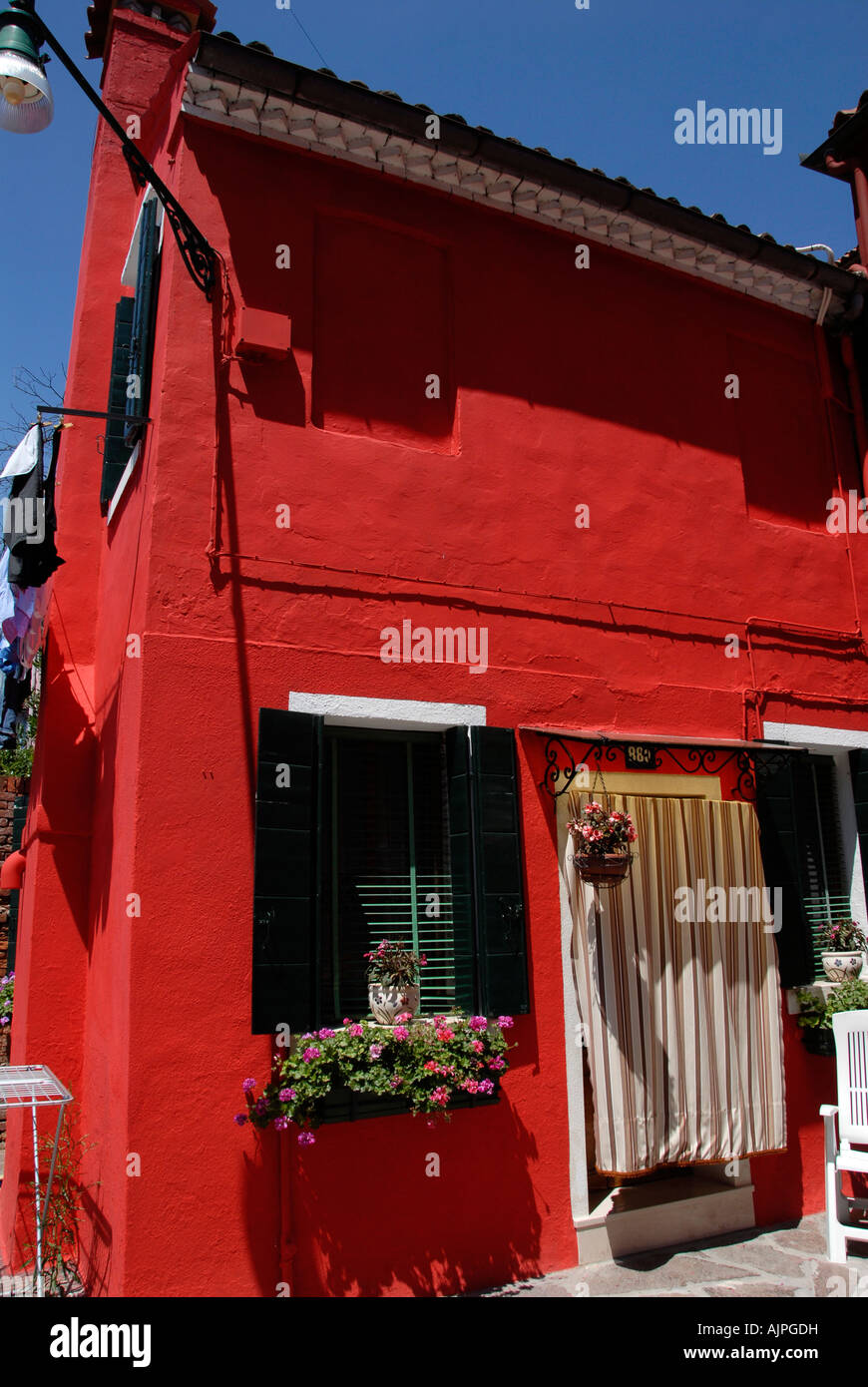Red house Burano Venice Italy Stock Photo - Alamy
