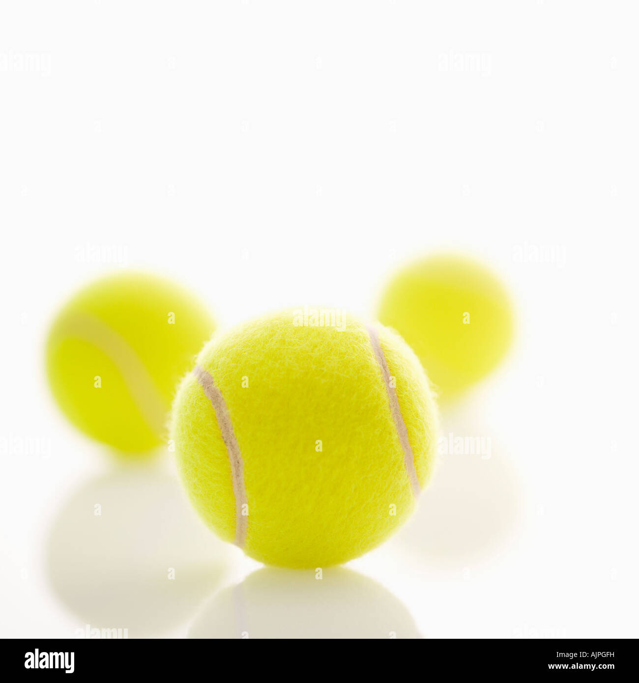 Three tennis balls Stock Photo - Alamy