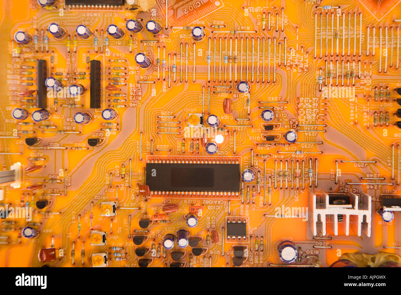 Orange circuit board detail Stock Photo - Alamy