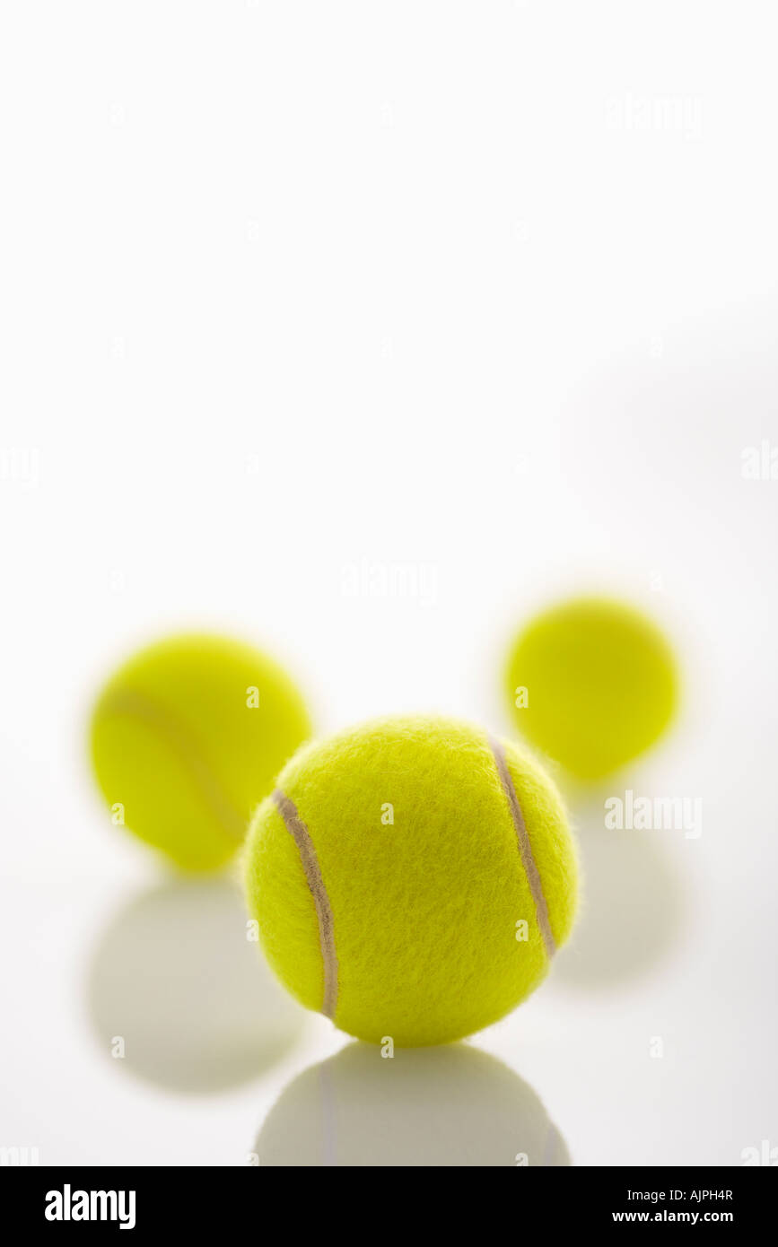 Three tennis balls Stock Photo - Alamy