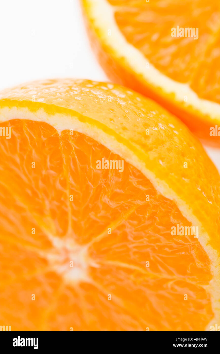 Close up of halved orange against white background Stock Photo - Alamy