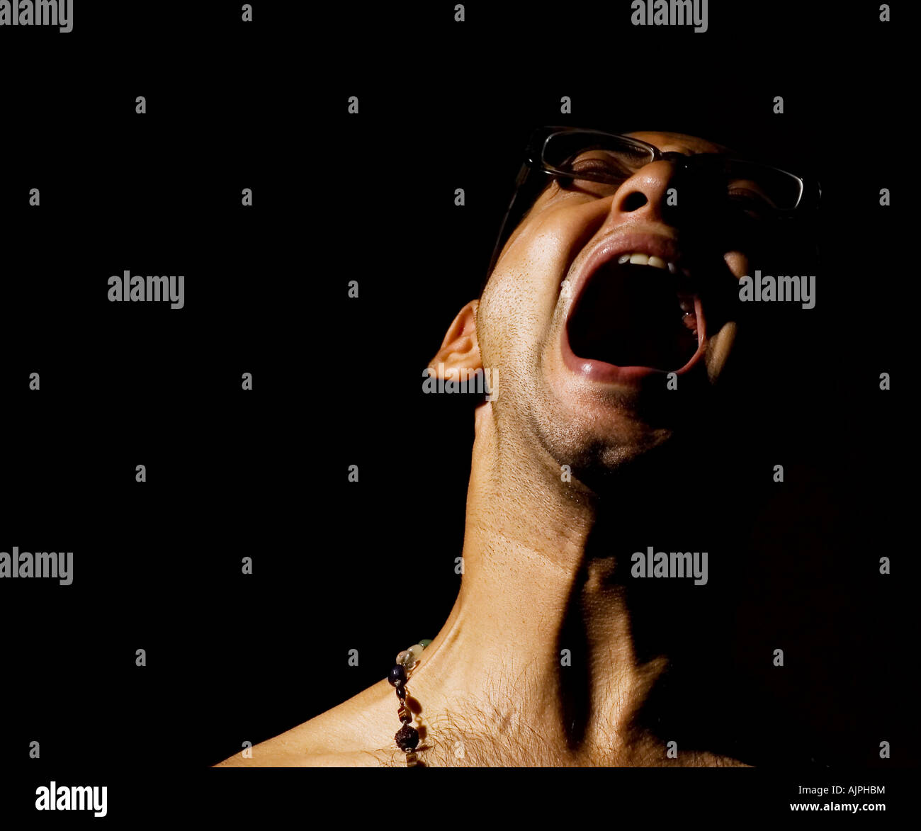 Portrait of a man screaming Stock Photo - Alamy