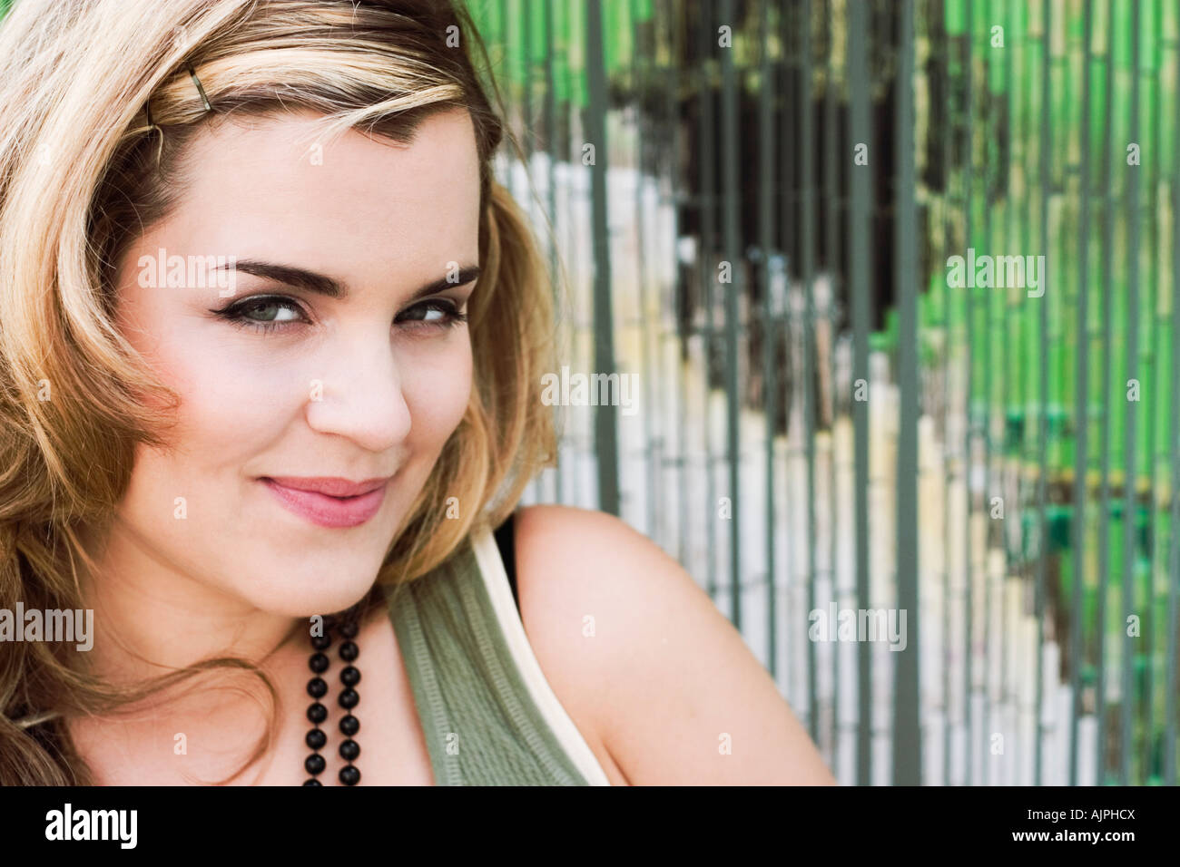 Woman with a coy expression Stock Photo - Alamy