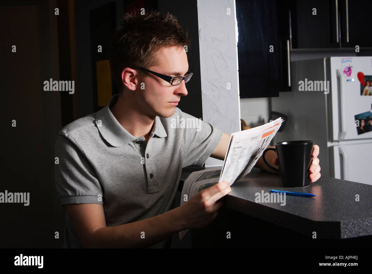 Man reading at home Stock Photo - Alamy