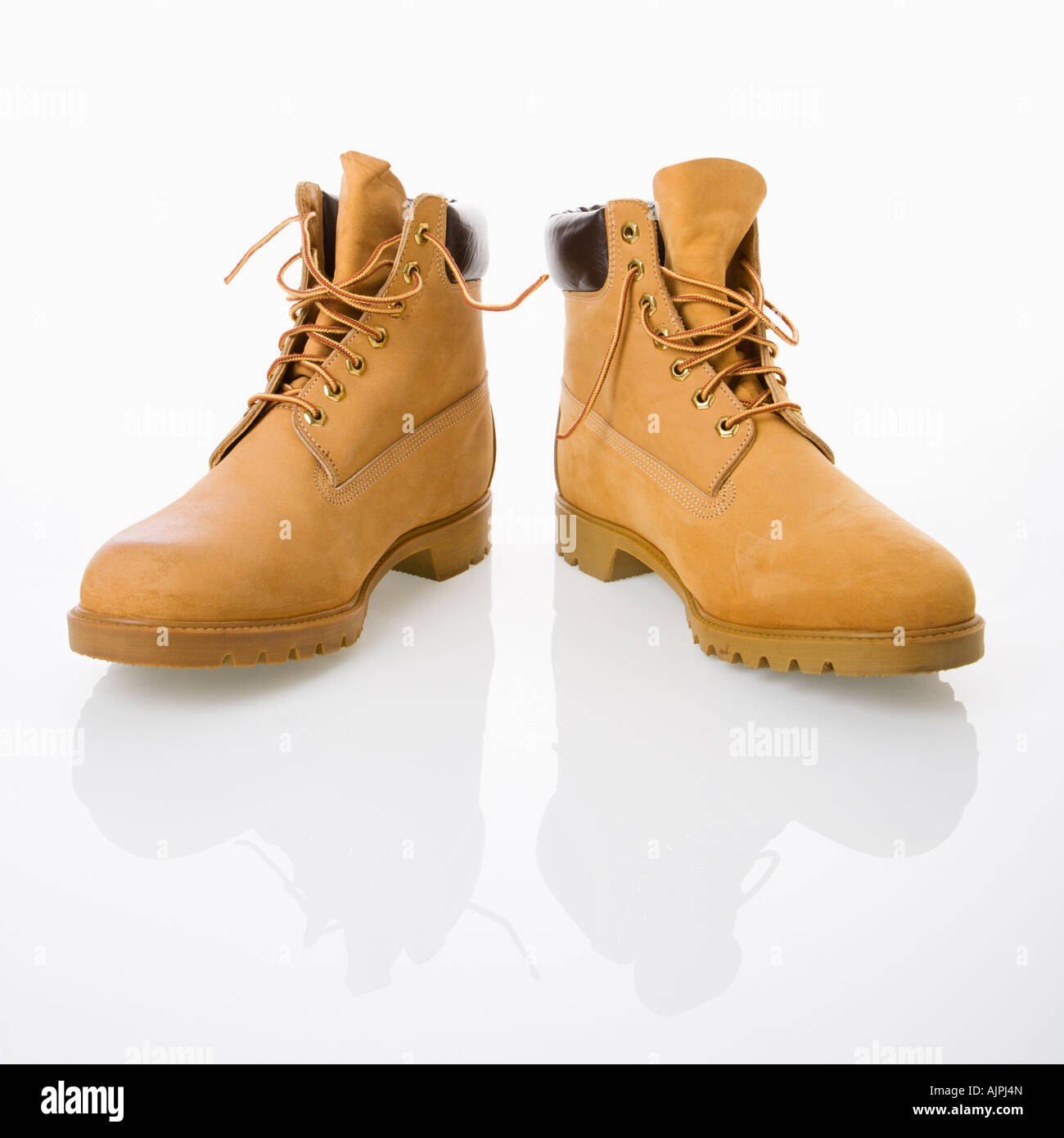 Pair of tan construction boots Stock Photo - Alamy