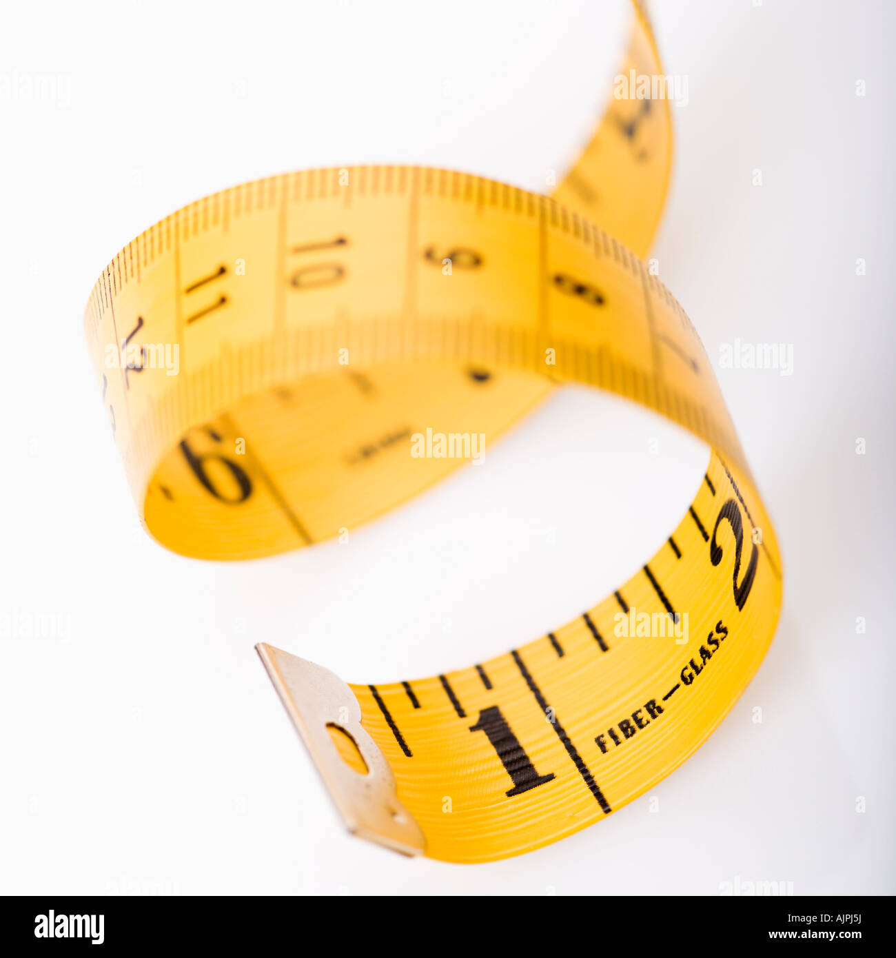 Curly measuring tape Stock Photo - Alamy