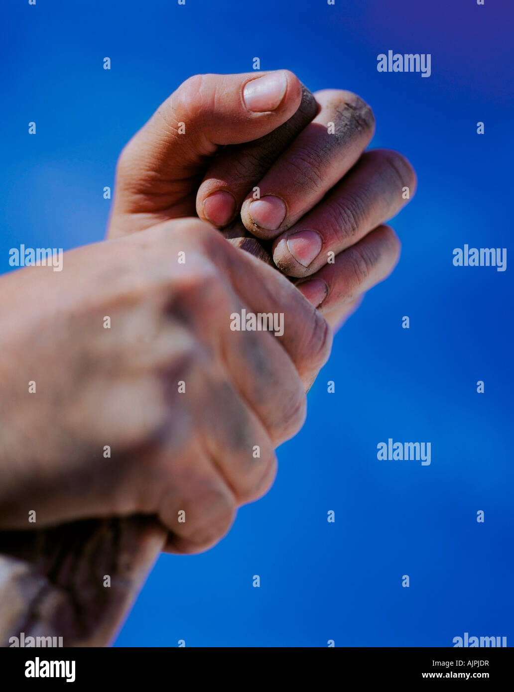 Hands holding stick against blue sky Stock Photo - Alamy