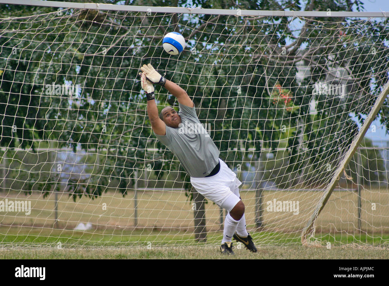 Goalie jumping hi-res stock photography and images - Alamy