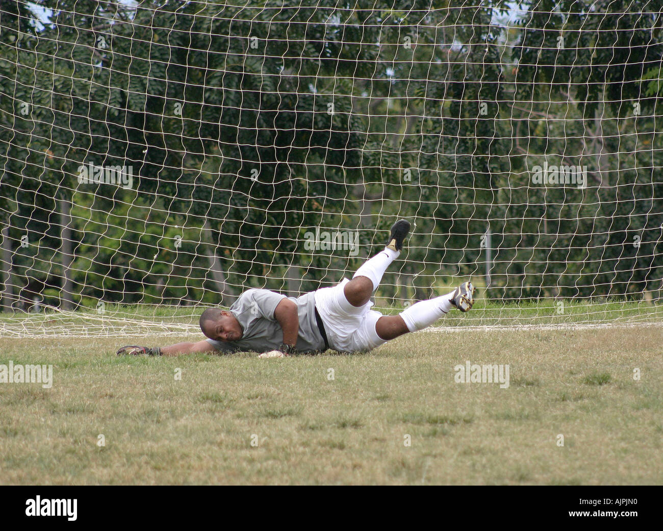 Action save diving football hi-res stock photography and images - Alamy